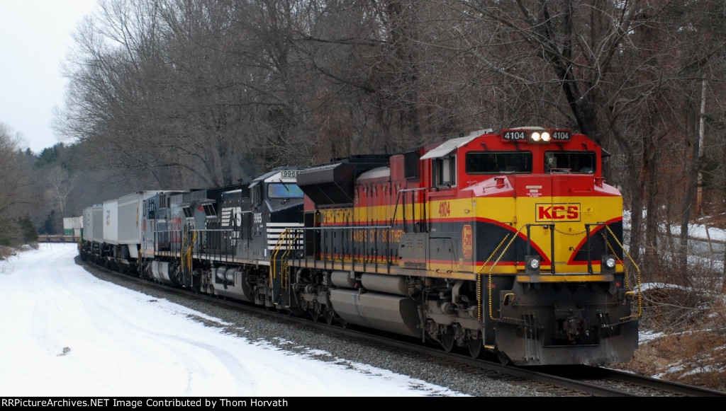 NS 212 has a varied consist of KCS units passing thru the S-Curves